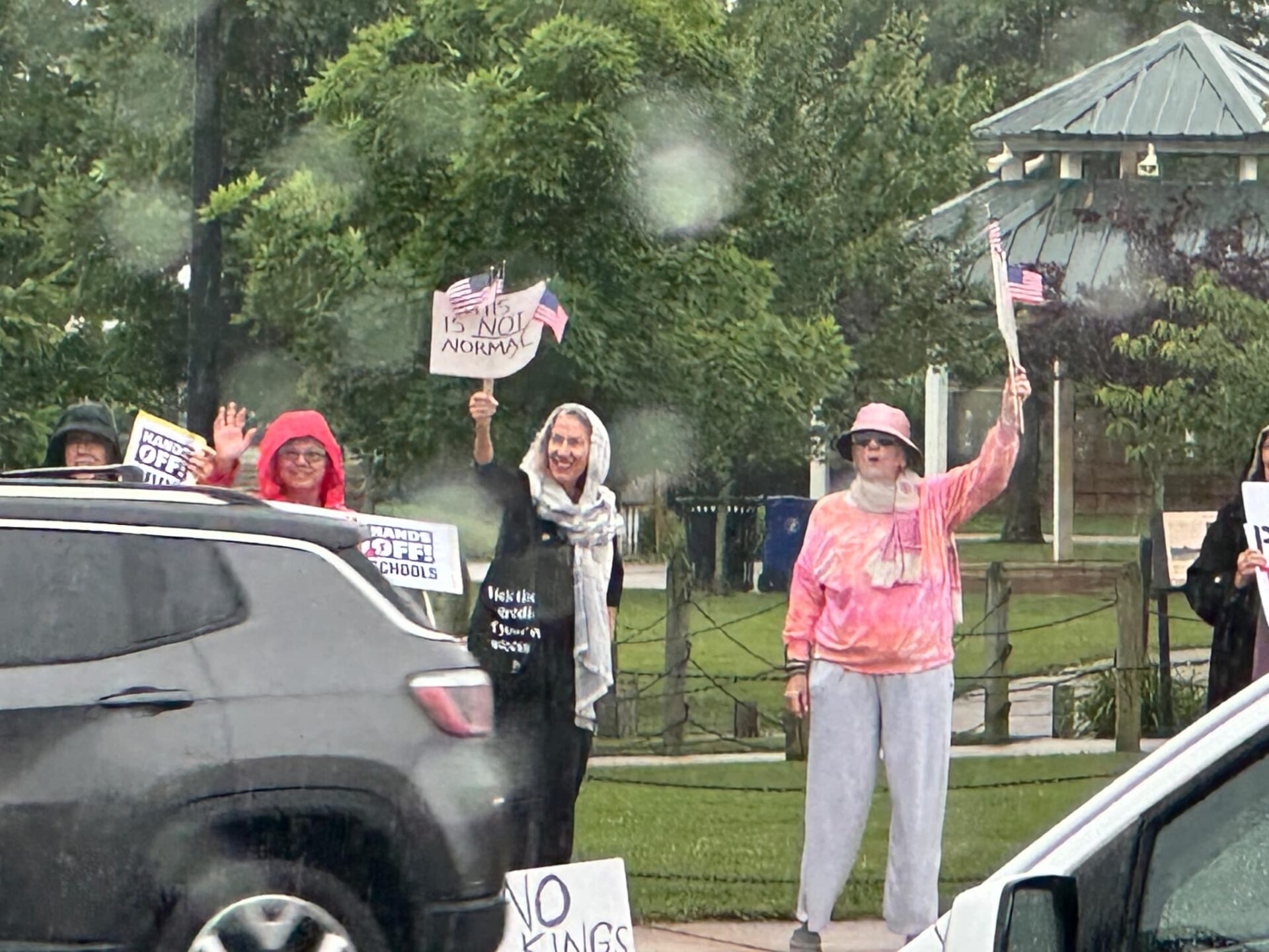 Small Protest Against Trump in Fizzles Out After Rain Shower in ...